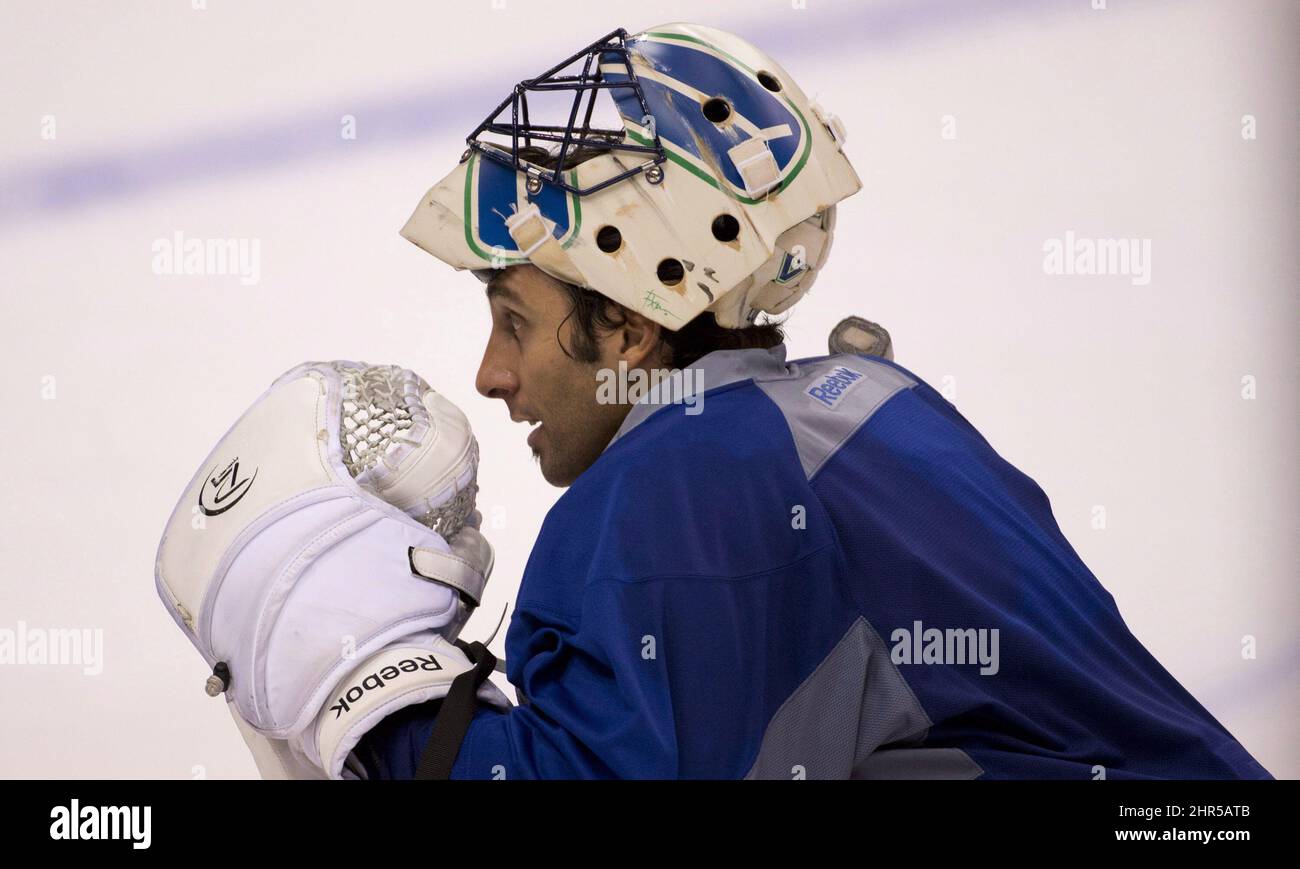 Vancouver Canucks goaltender Roberto Luongo pauses for a moment during ...