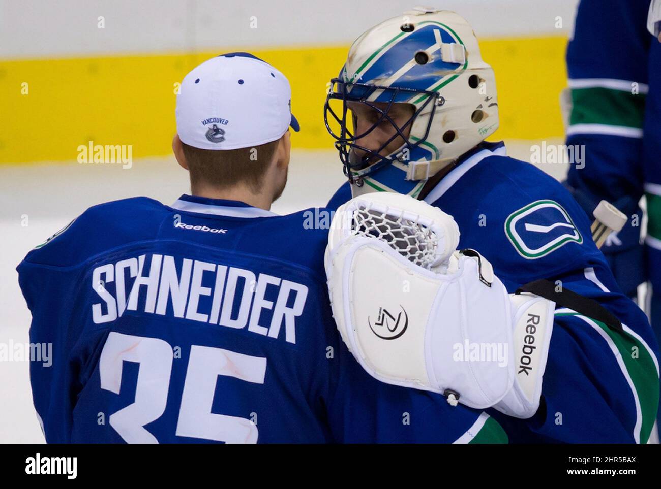 Vancouver Canucks' goalie Cory Schneider, left, and goalie Roberto ...
