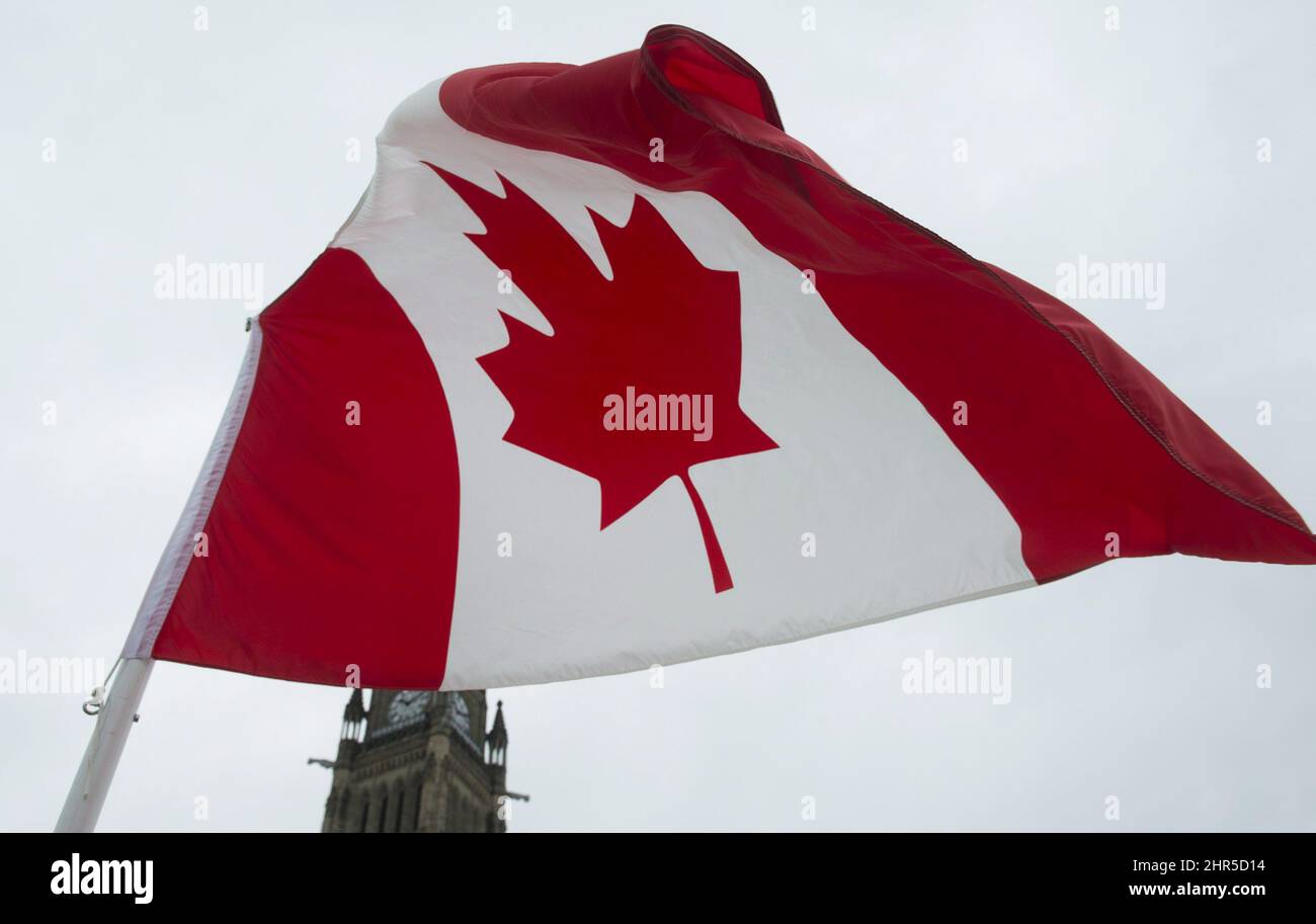 A Canadian flag flies on Parliament Hill Friday February 15, 2013 in ...