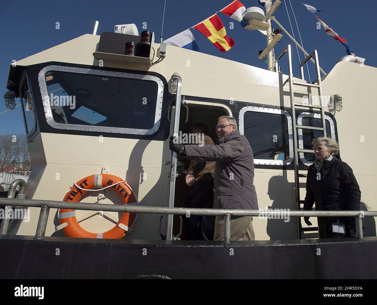 Premier Darrell Dexter boards the tugboat Strait Raven as the vessel is ...