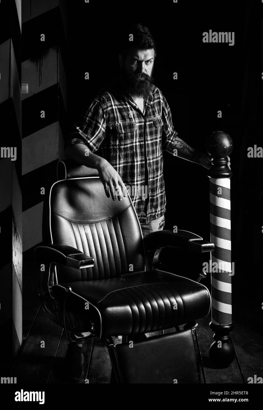 Barber scissors and straight razor. Bearded client visiting barber shop ...