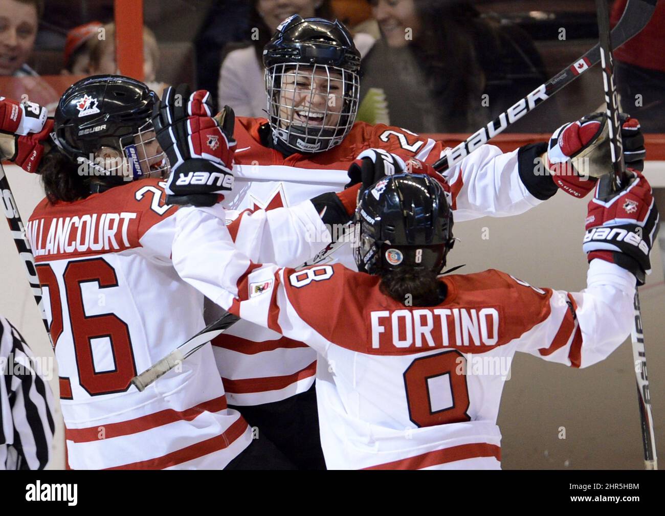 Team Canada's Natalie Spooner (center) celebrates her goal with ...