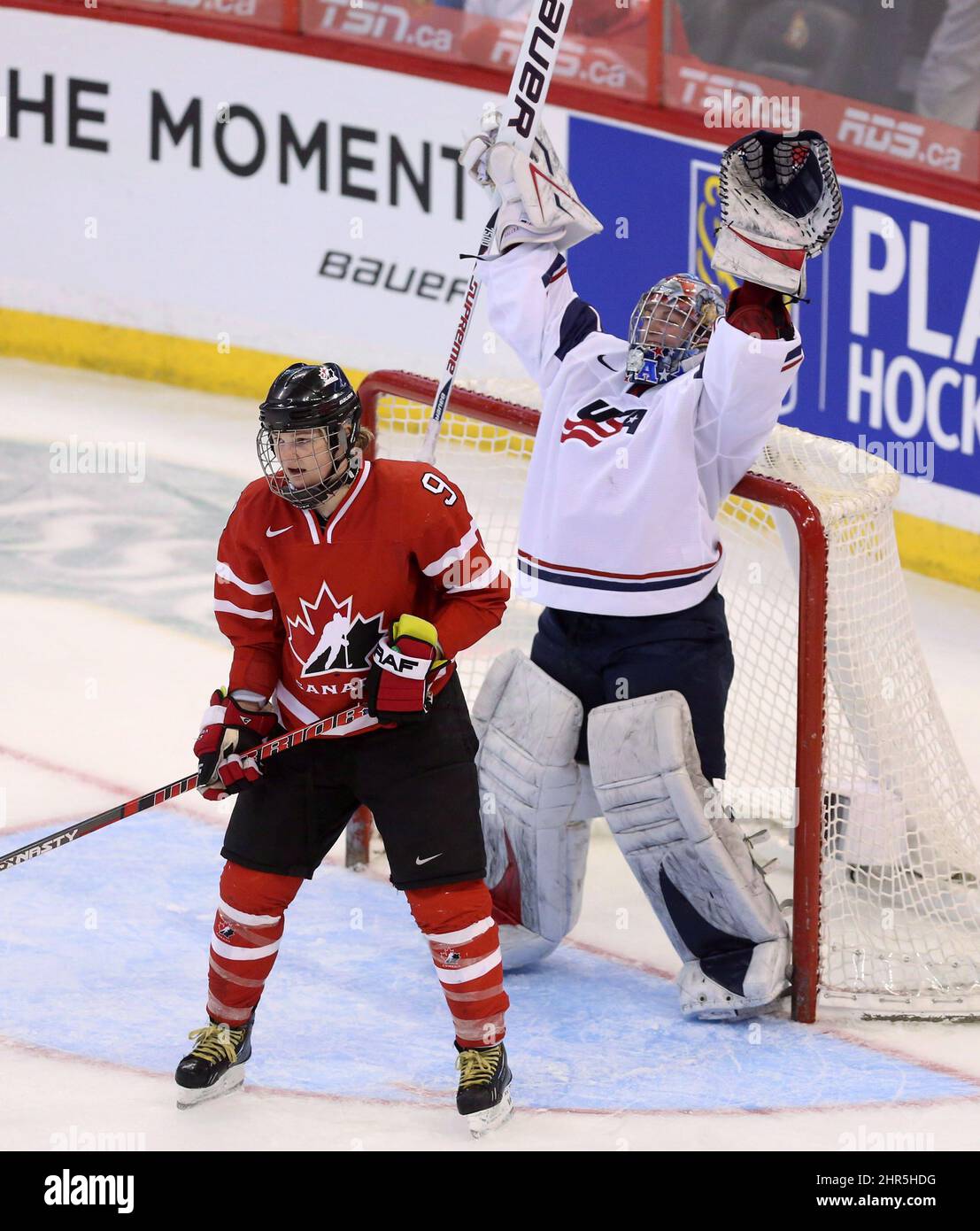 Team USA goalie Jessie Vetter celebrates as Team Canada's Jennifer ...