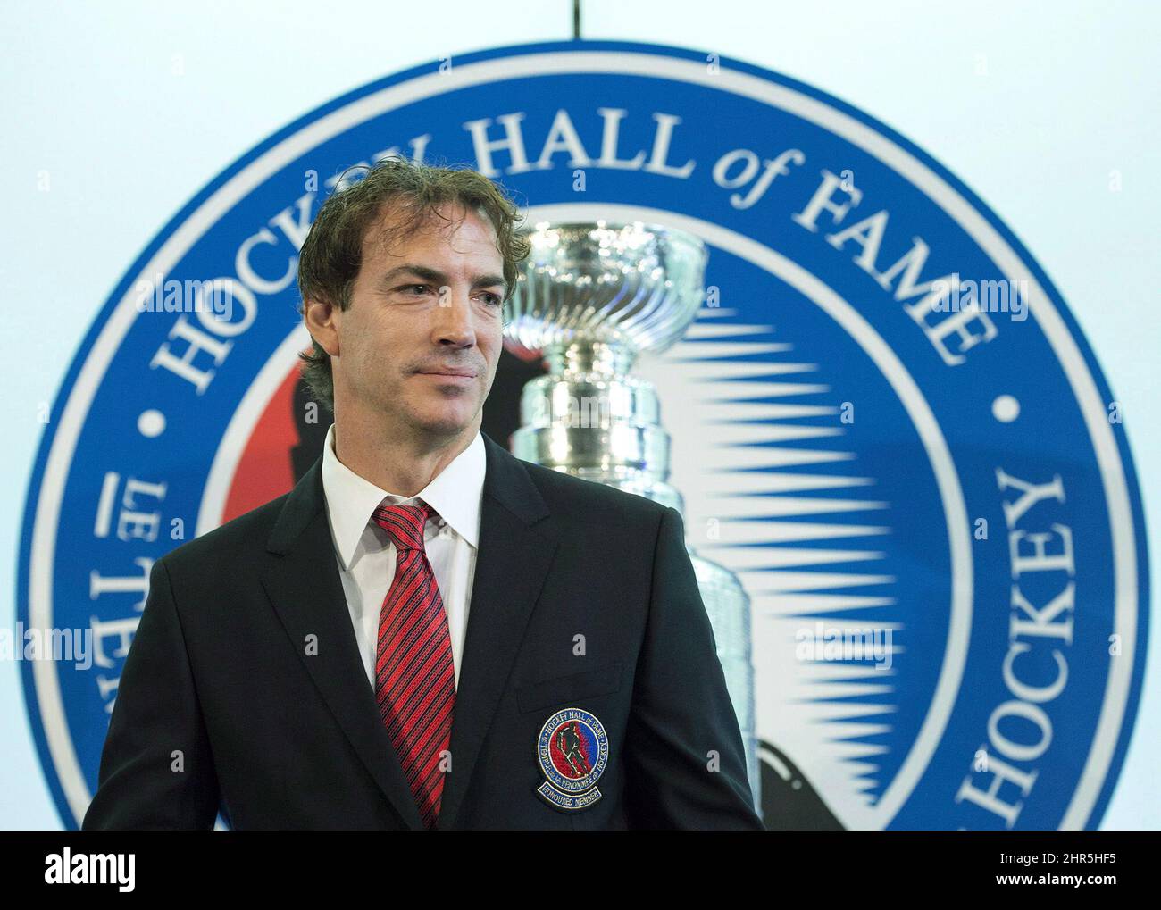 HHoF inductee Joe Sakic walks on stage at the Hockey Hall of Fame in ...