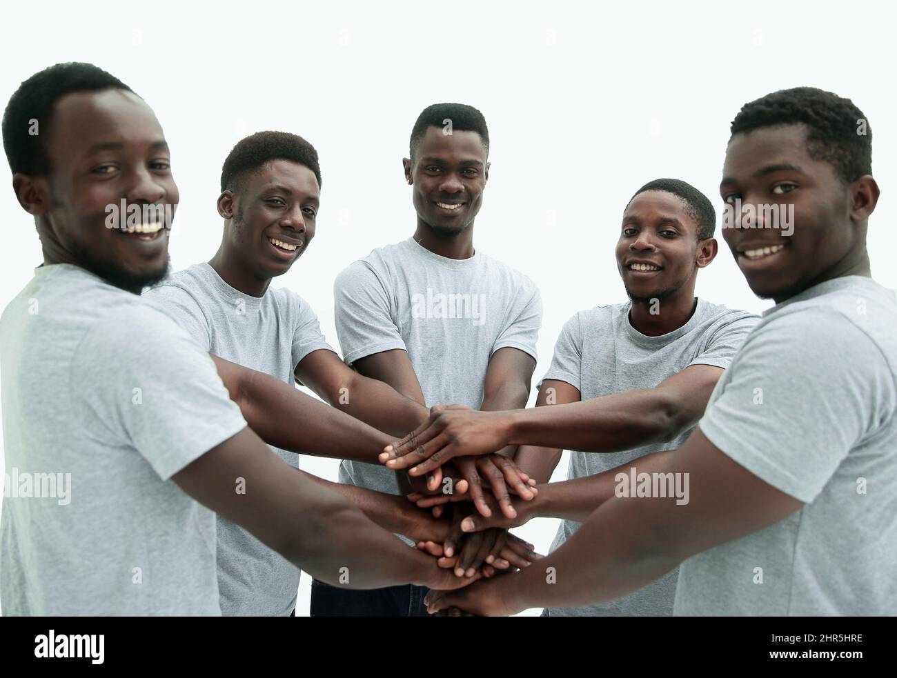 group of diverse guys making a tower out of hands Stock Photo - Alamy