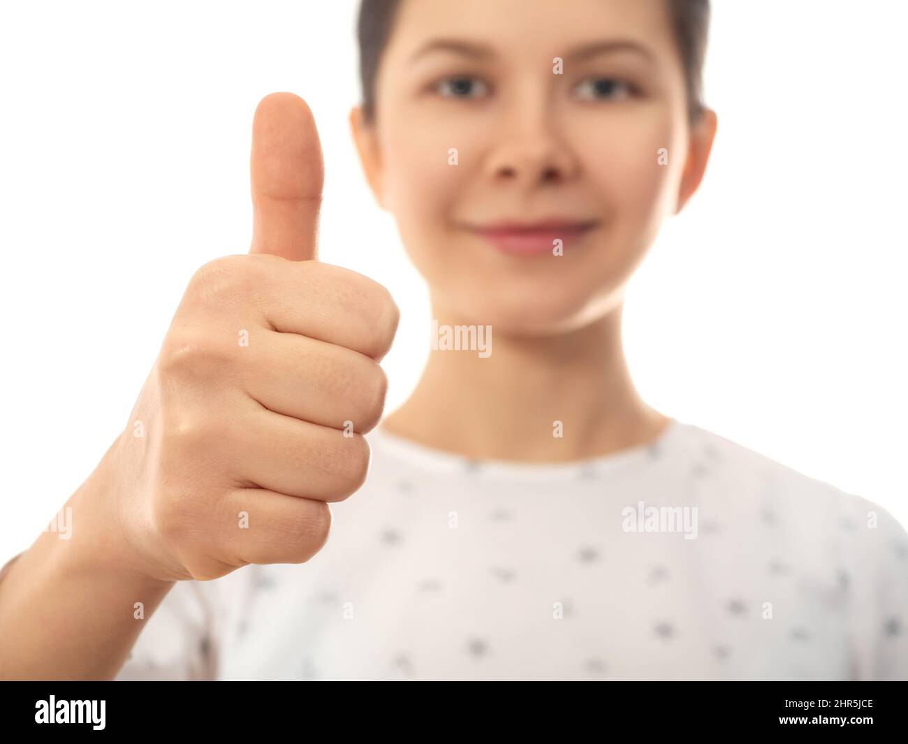 Woman showing thumb up sign Stock Photo - Alamy