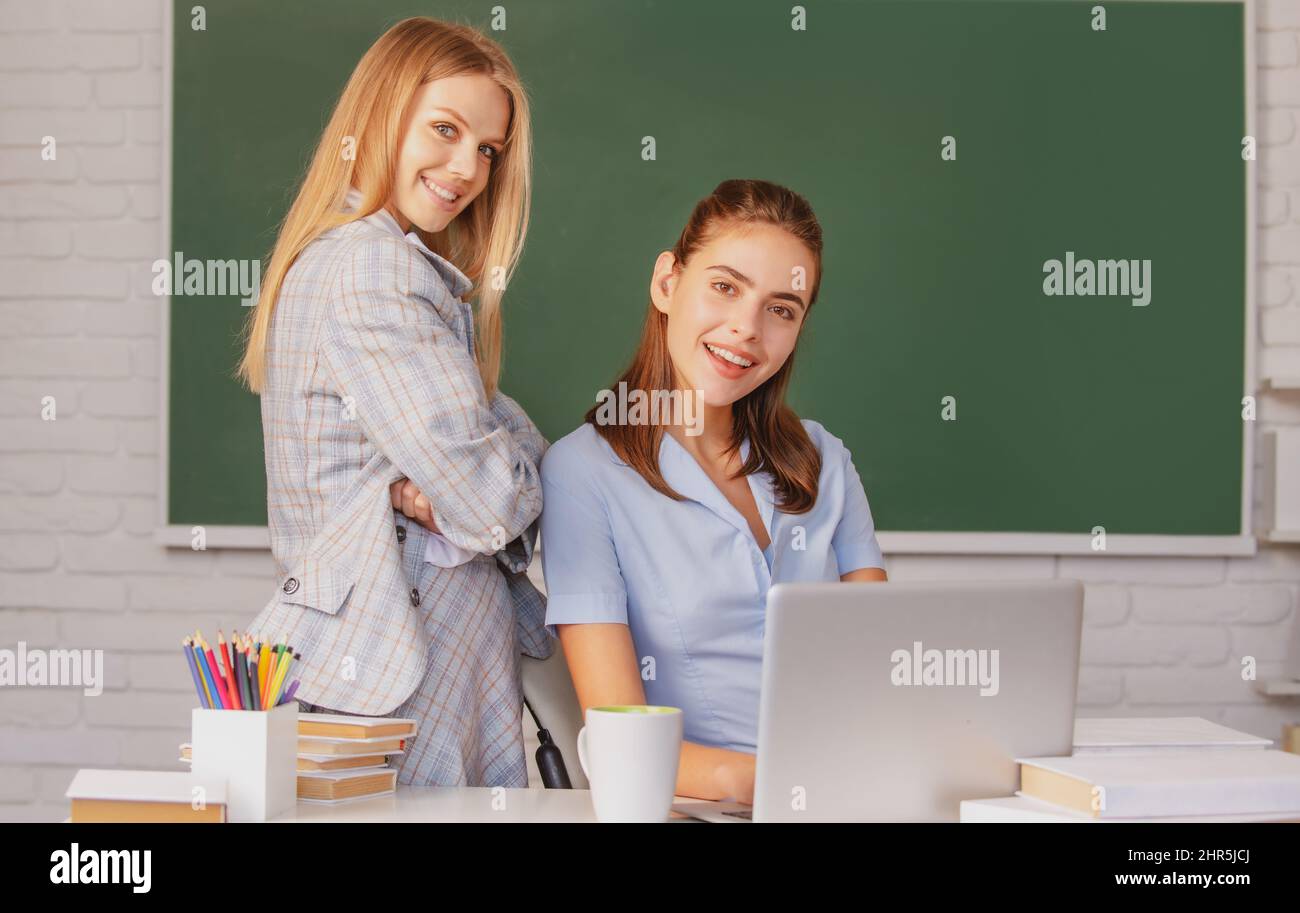 Students girls talking each other in classroom at school college ...