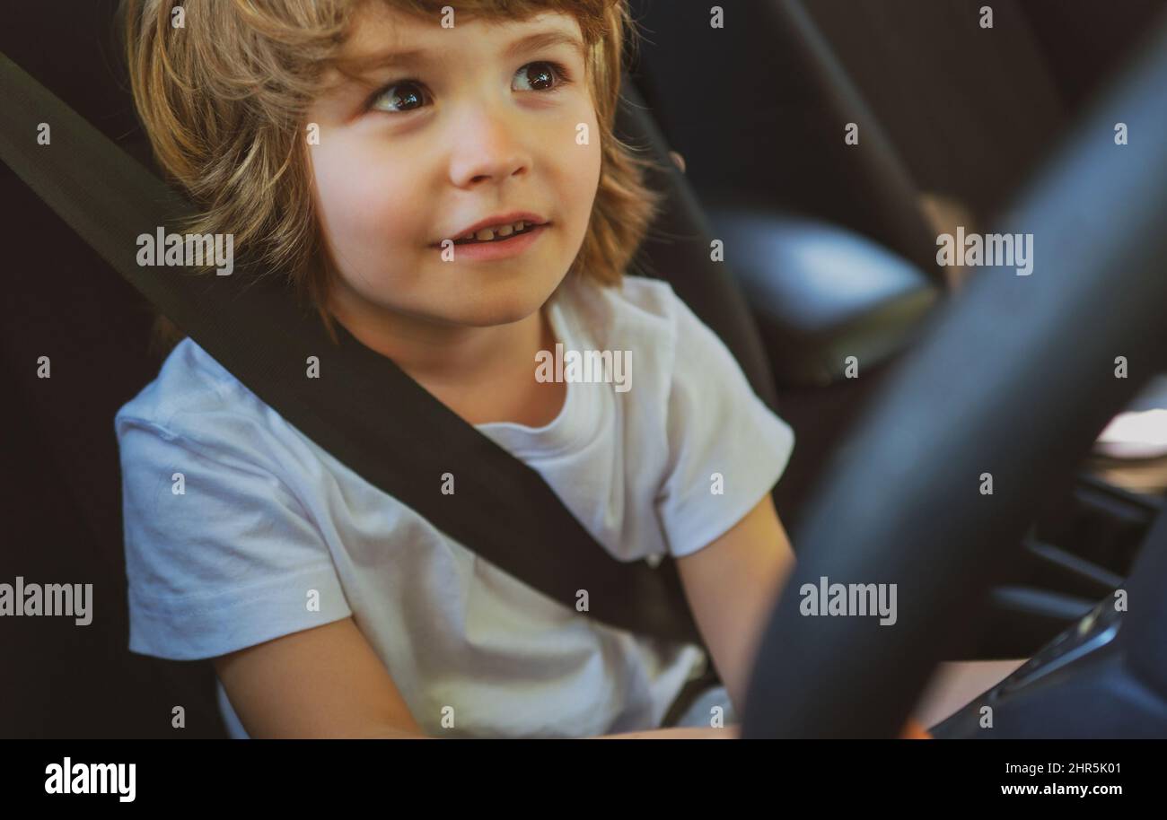 Child driver. Cute child boy while driving car as driver. Baby kid ...