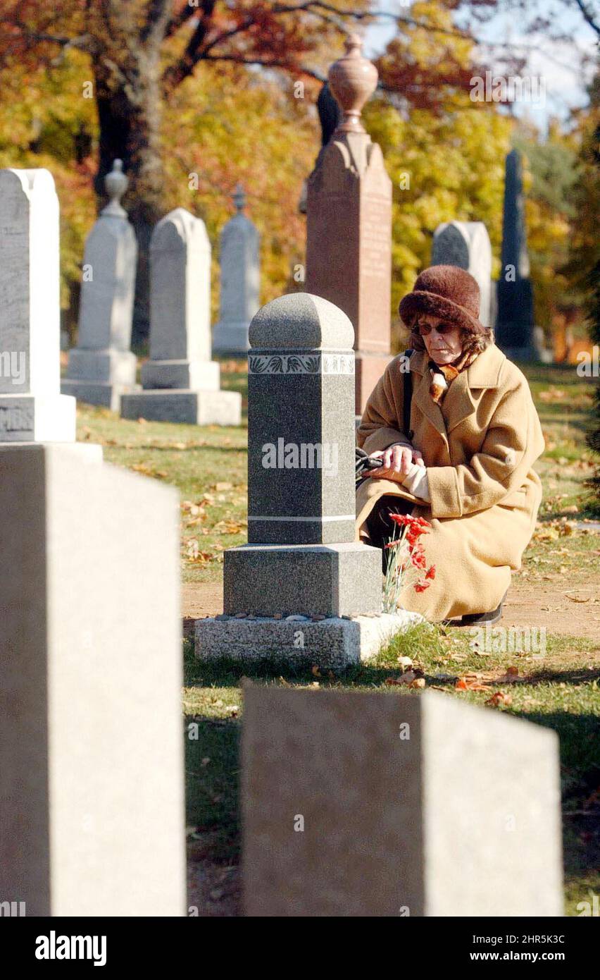 PA PHOTOS/CP - UK USE ONLY: Magda Schleifer looks over the grave of the ...