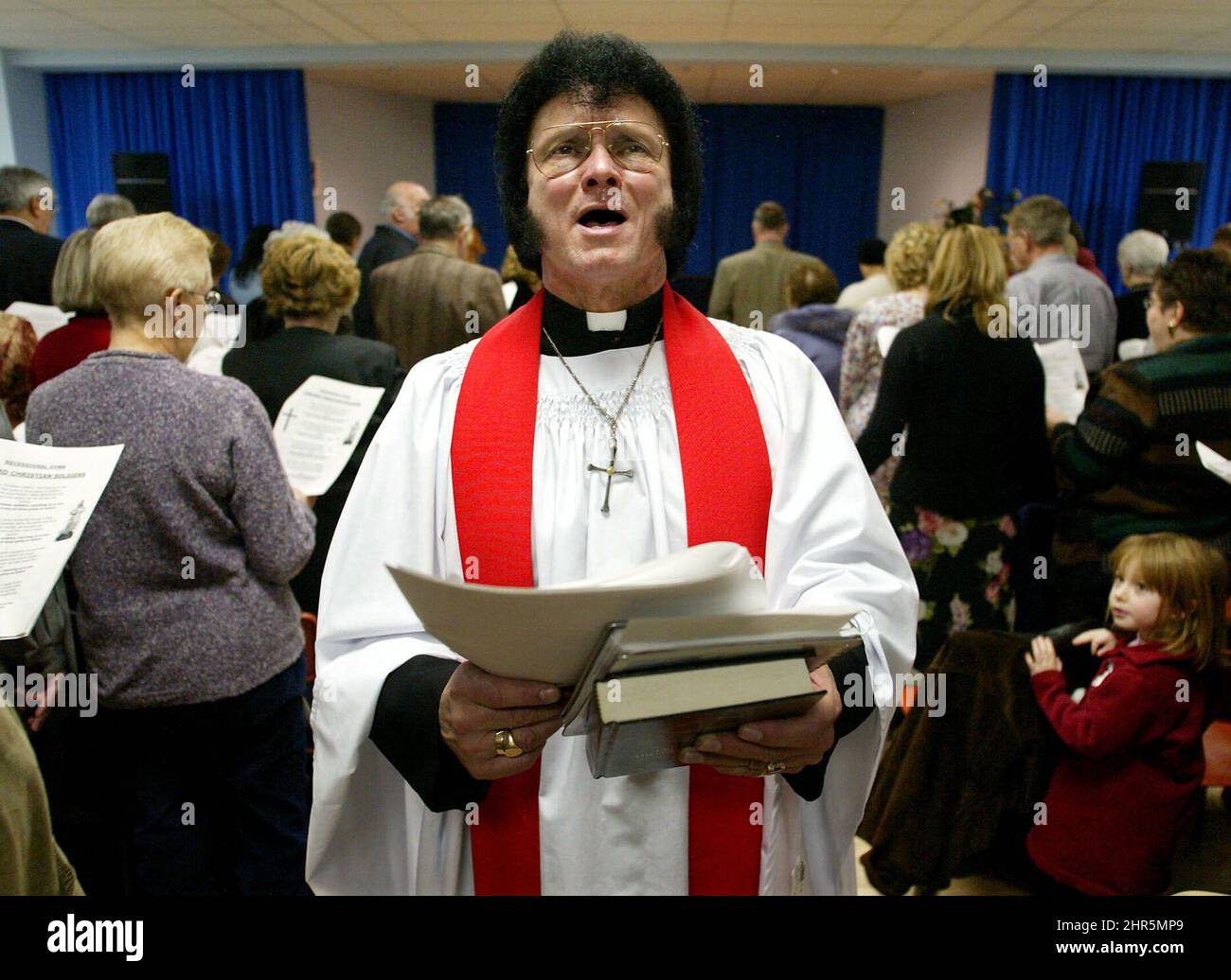 PA PHOTOS / CP - UK USE ONLY : Reverand Dorian Baxter sings a song as ...