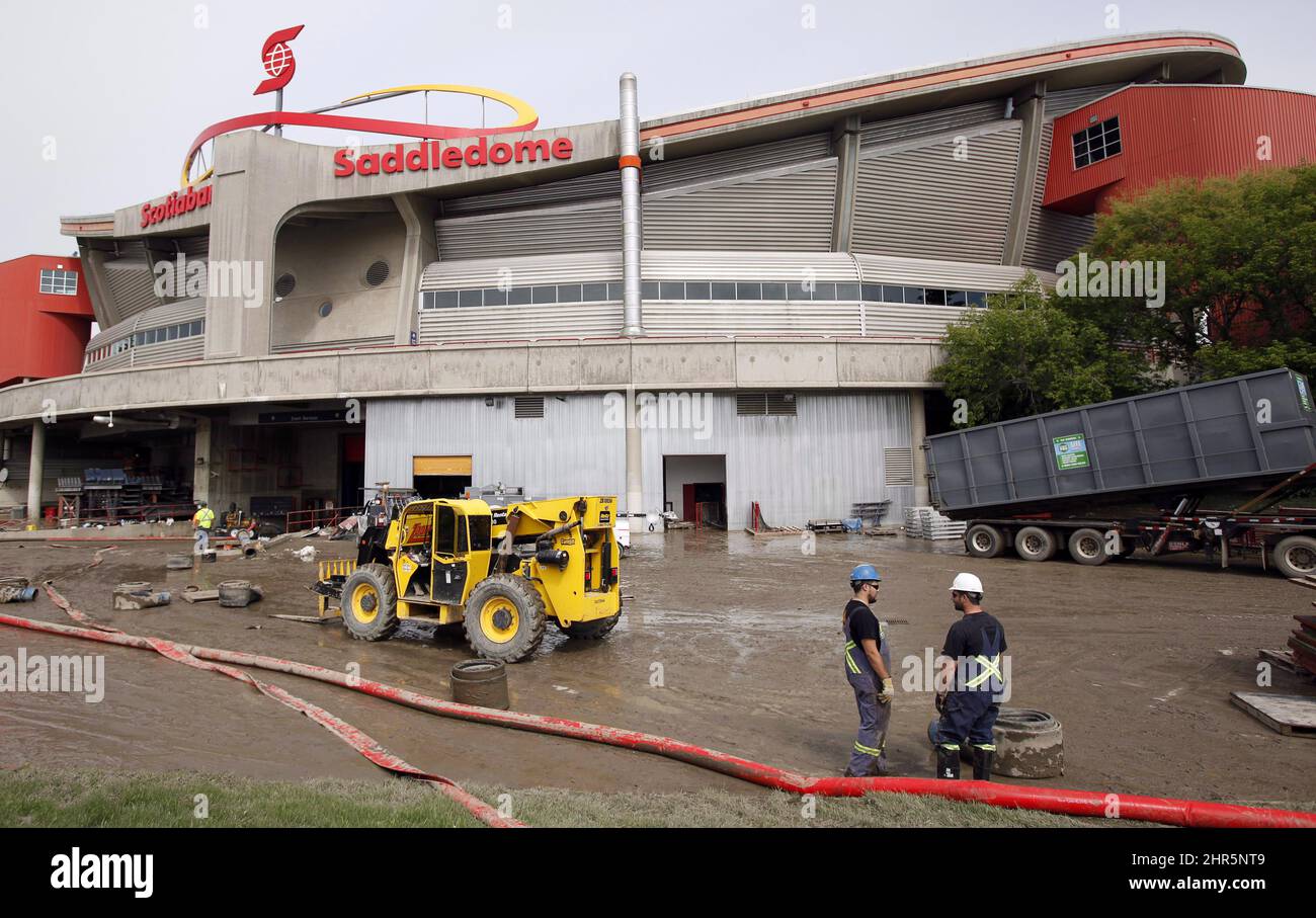 Clean-up crews work at the Saddledome in Calgary, Alta., Monday, June ...