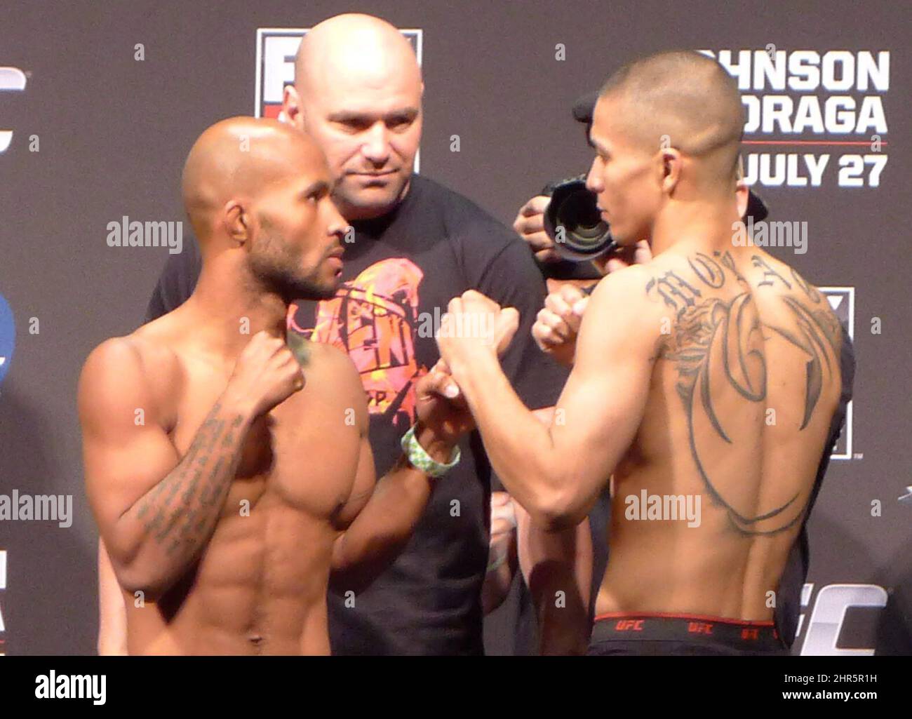 Flyweight champion Demetrious (Mighty Mouse) Johnson (left) and ...