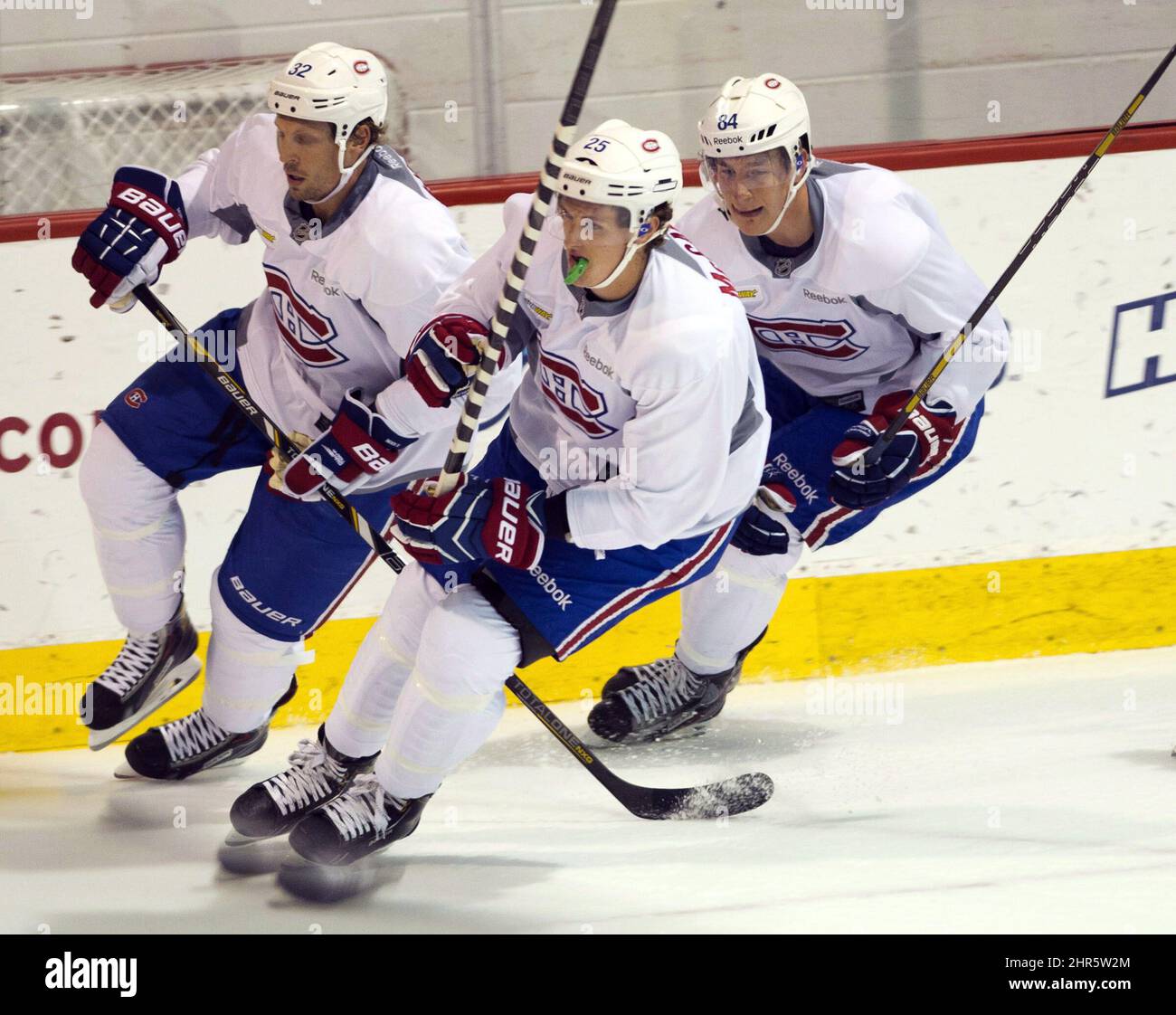 Montreal Canadiens Travis Moen, left, Michael McCarron, center, and ...