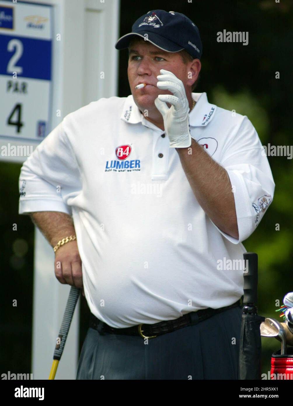 John Daly from Dardanelle, Ariz., smokes a cigarette as he waits to tee ...