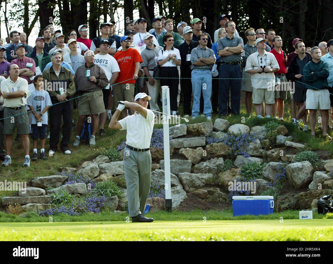 Spectators watch as Mike Weir, from Bright's Grove, Ont., tees off on ...