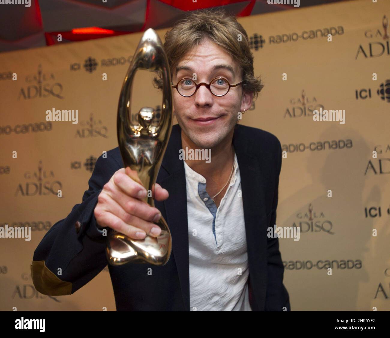 Fred Pellerin holds up his Felix award for show of the year ...