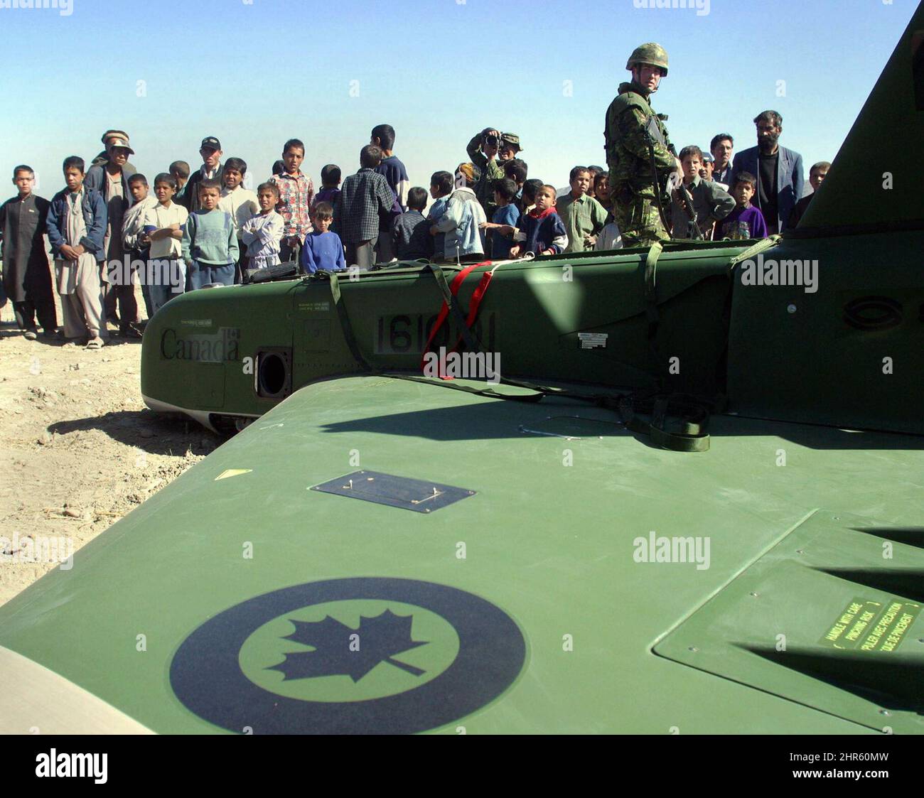 Capt. Ian Plummer of Sault Ste. Marie, Ont., stands guard as soldiers ...