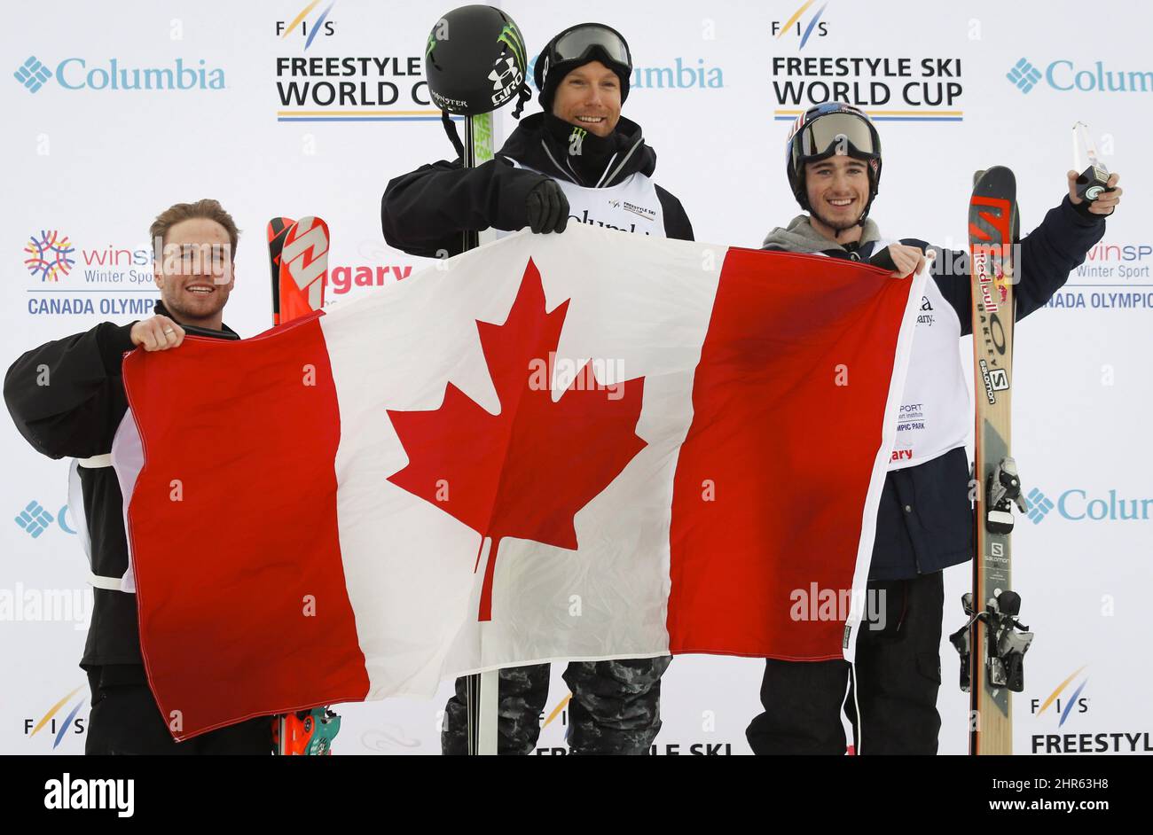 Canada's Justin Dorey, centre, celebrates his victory with second place ...