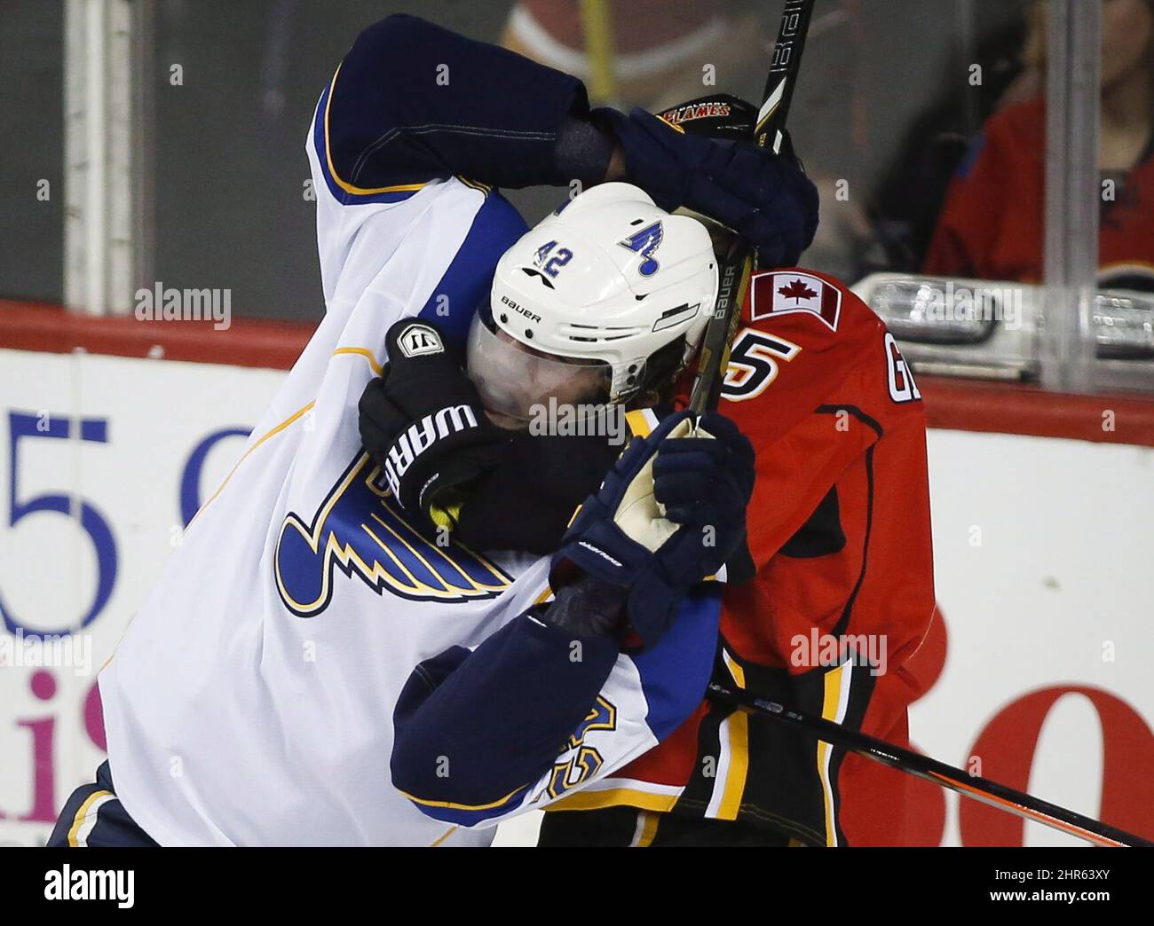 St. Louis Blues' David Backes, left, gets grabbed in a choke hold by ...