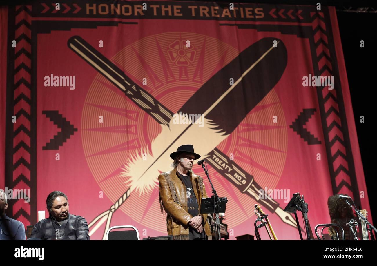 Singer Neil Young speaks during a news conference before the last ...