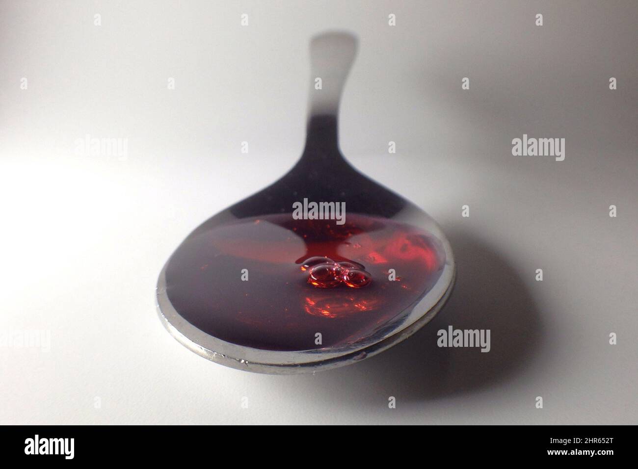 A spoonful of cough syrup is shown in Toronto, Saturday, Jan.25, 2014 ...