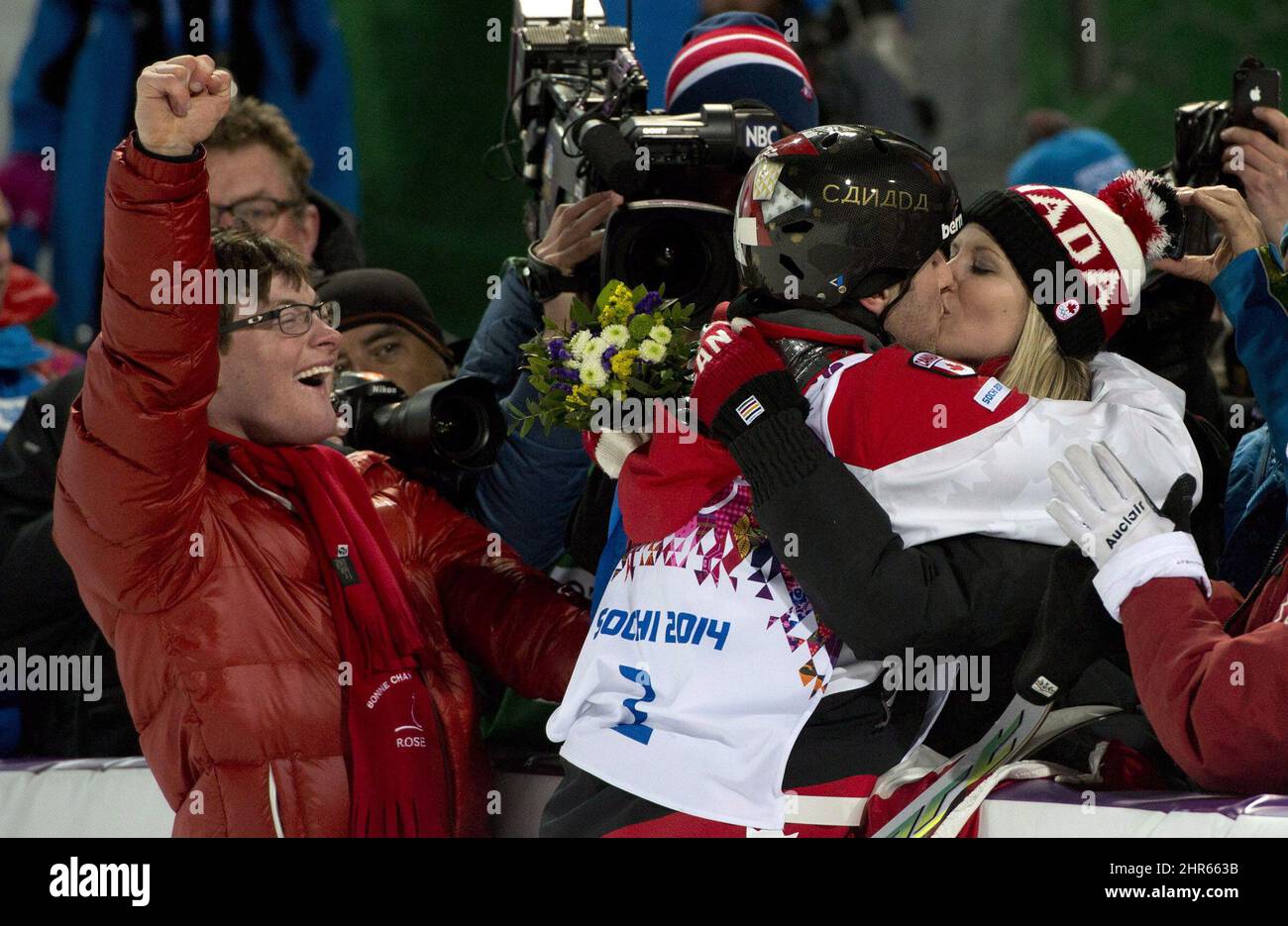 Canadian Alex Bilodeau gives his girlfriend a kiss as brother Frederic ...