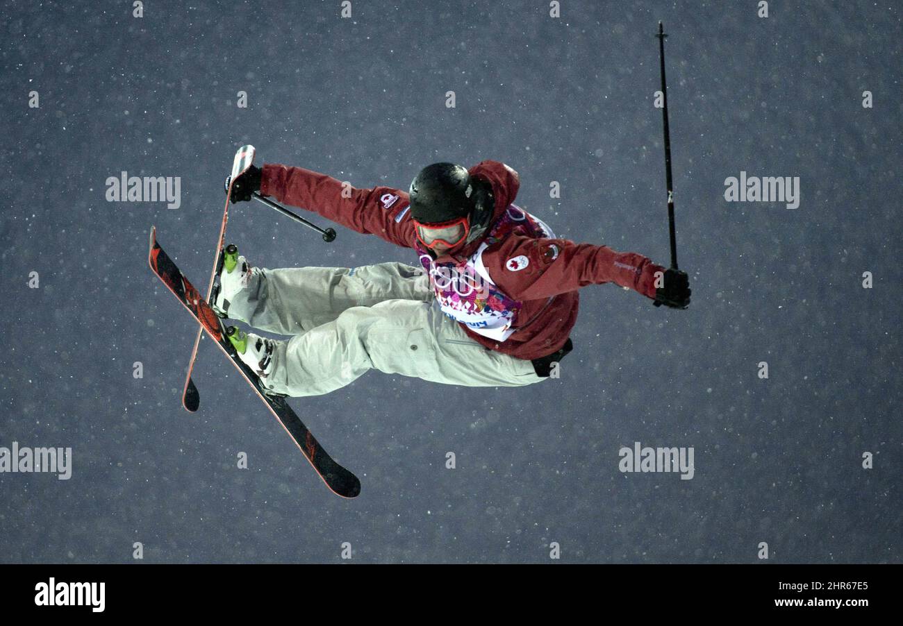 Canada's Mike Riddle flies through the air during men's freestyle ...