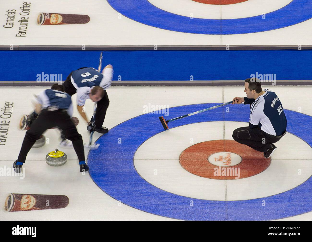 Nova Scotia skip Jamie Murphy directs Jordan Pinder, left, and Mike ...