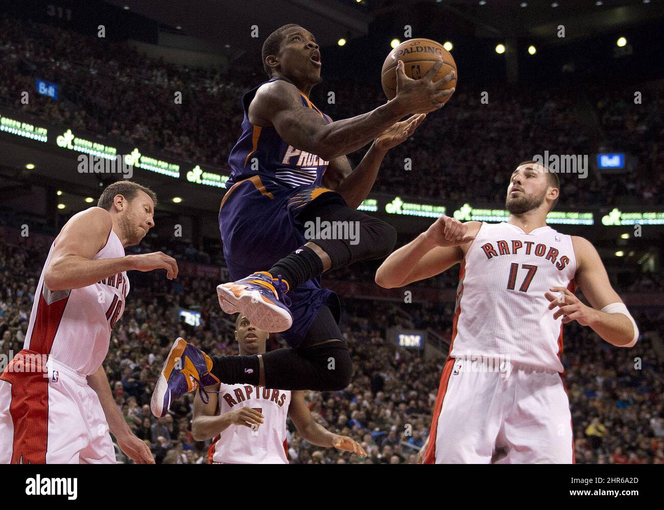 Phoenix Suns guard Eric Bledsoe (centre) soars to the hoop between ...