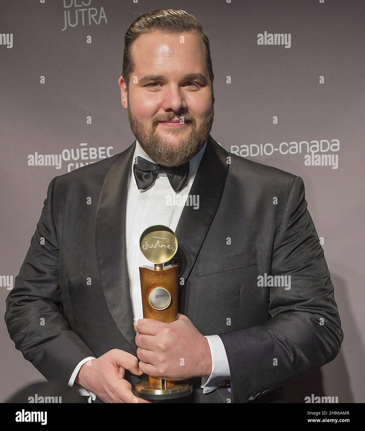 Best Actor winner Antoine Bertrand poses backstage with his trophy at ...