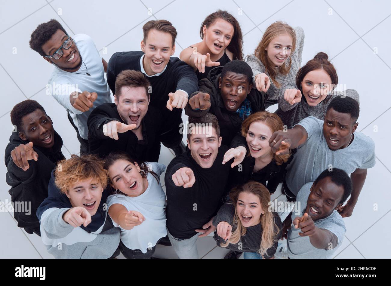 multiethnic group of five male and female friends hugging and lo Stock ...