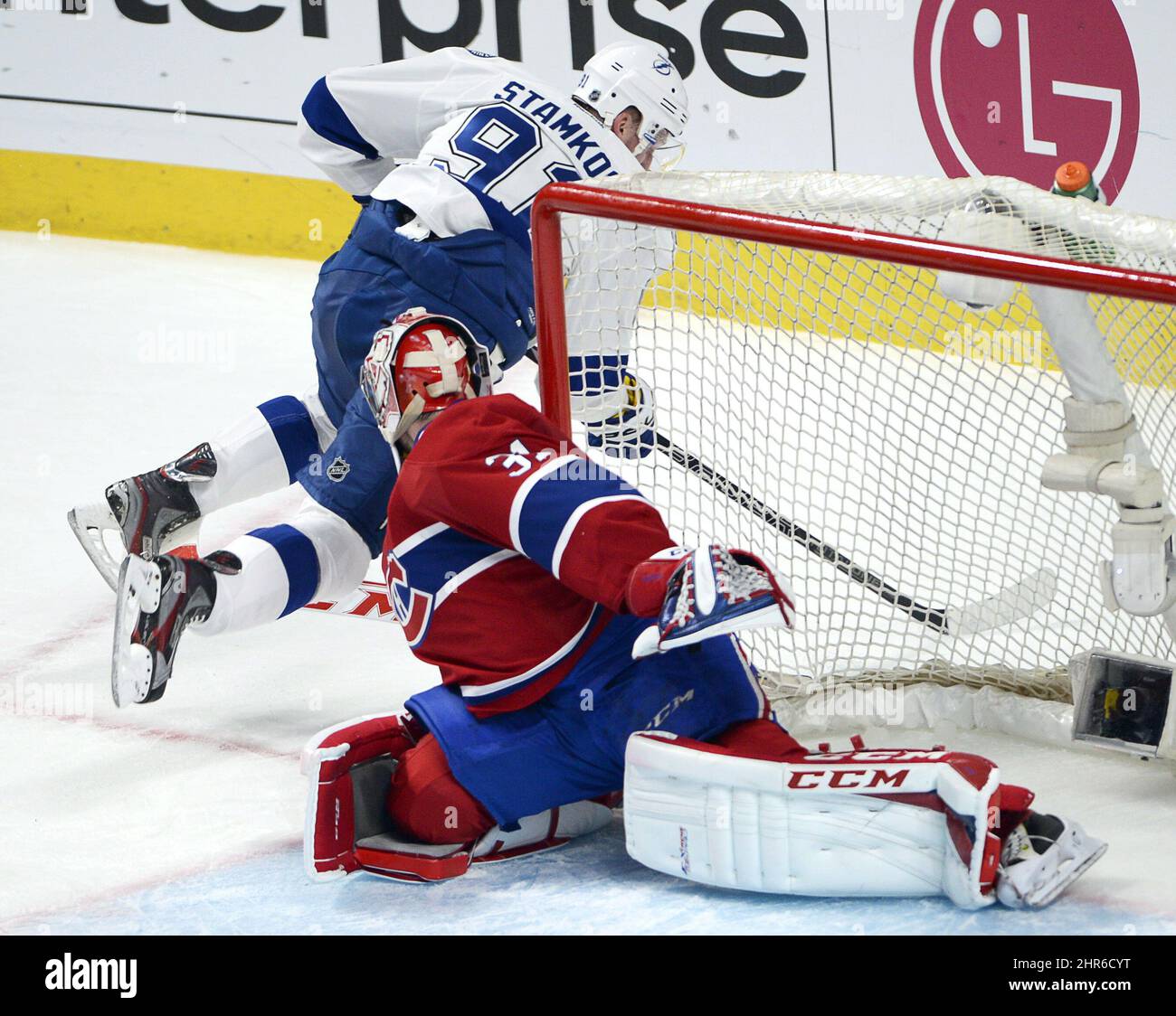 Montreal Canadiens goalie Carey Price (31) trips Tampa Bay Lightning's ...