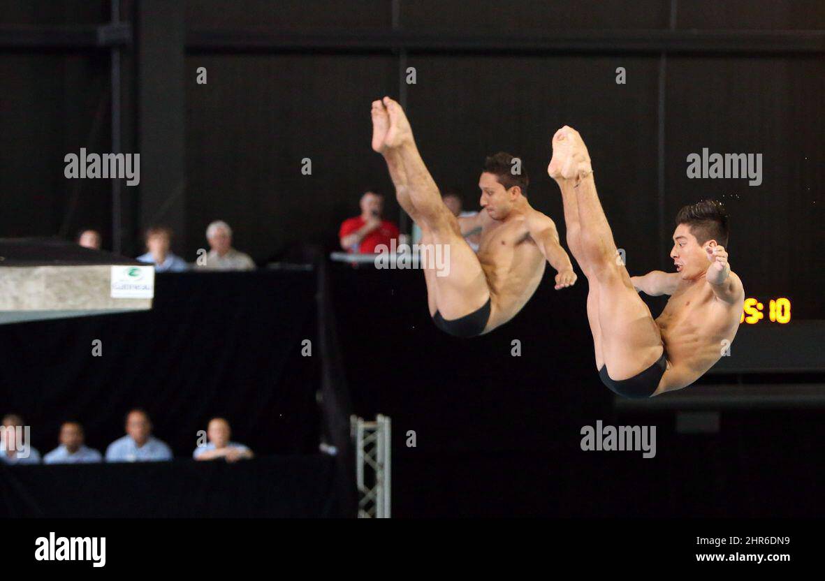 Carlos Moreno and Julian Sanchez of Mexico perform a dive in the men's ...