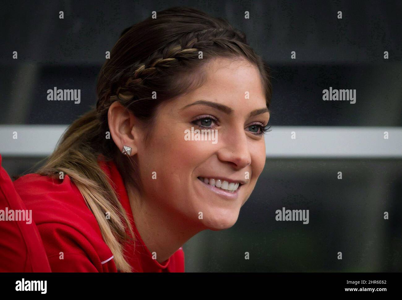 Canada's Kara Lang, of Oakville, Ont., sits on the bench as her ...