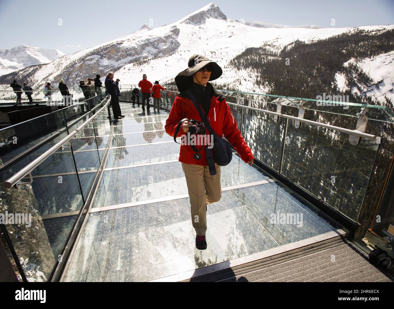 A tourist steps off the glass floored walkway of the newly opened ...