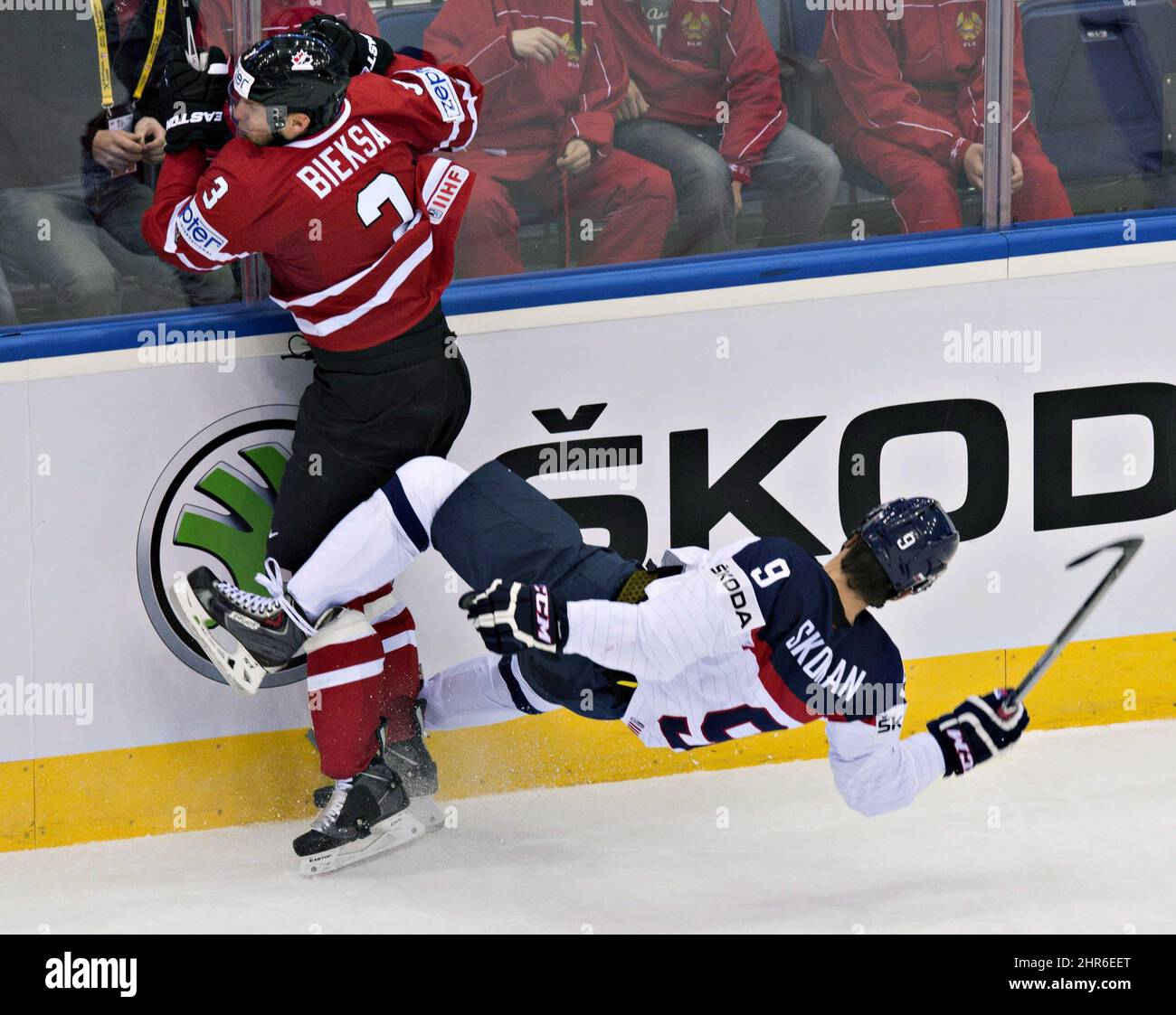 Slovakia's David Skokan falls after colliding with Canada's Kevin ...