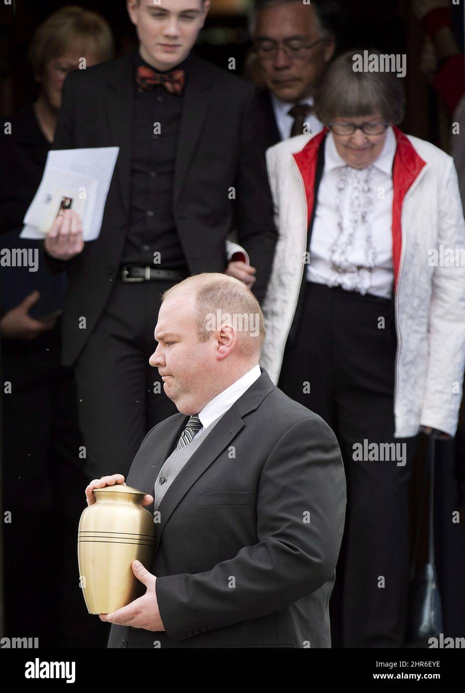 Widow Claire Mowat, right, and her grandson Justin Mowat, left, walk ...