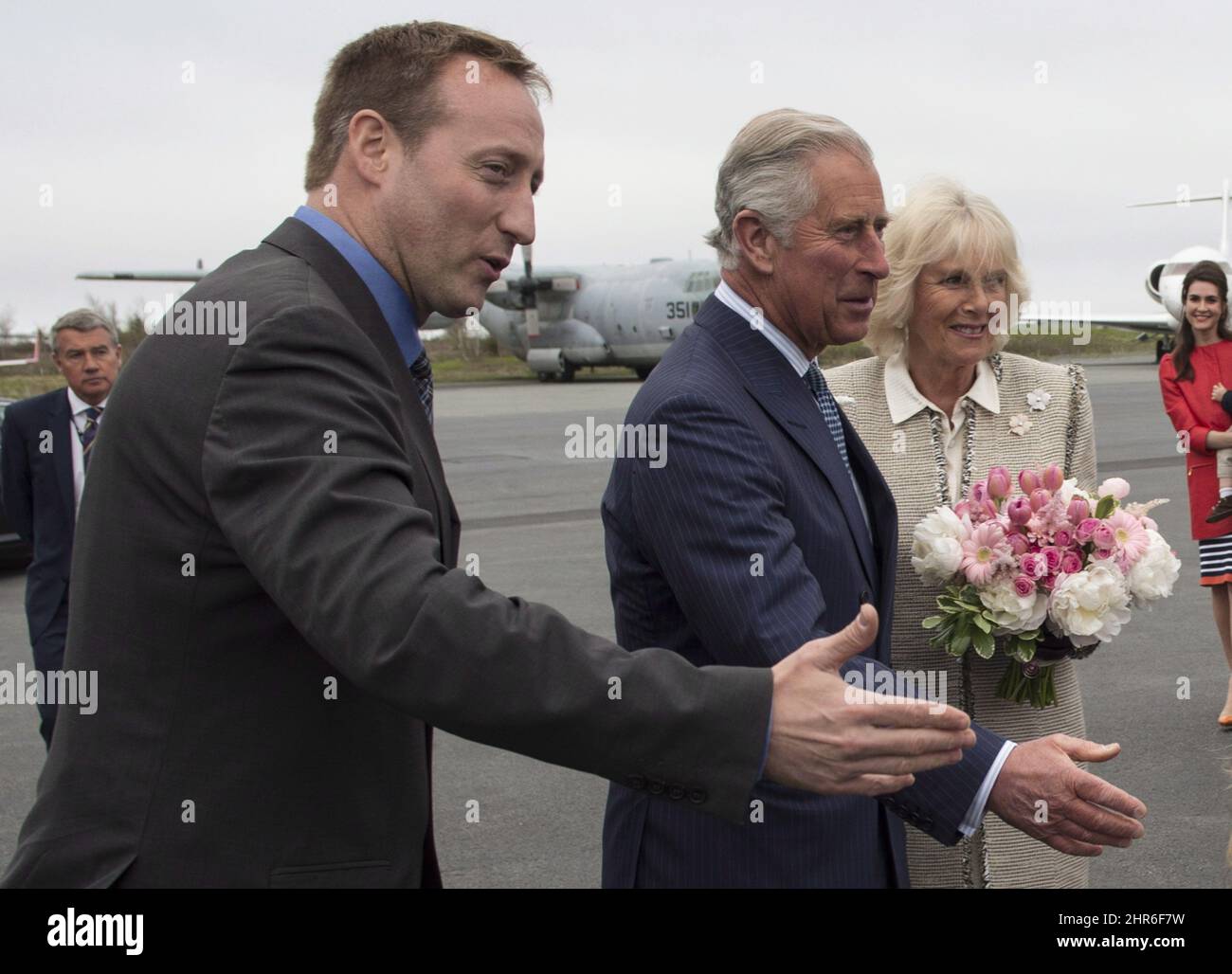 Prince Charles, centre, and his wife Camilla, right, are greeted by ...