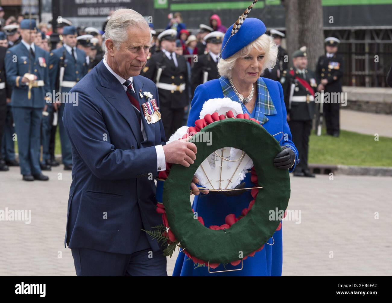 Prince Charles and his wife Camilla lay a wreath during welcoming ...