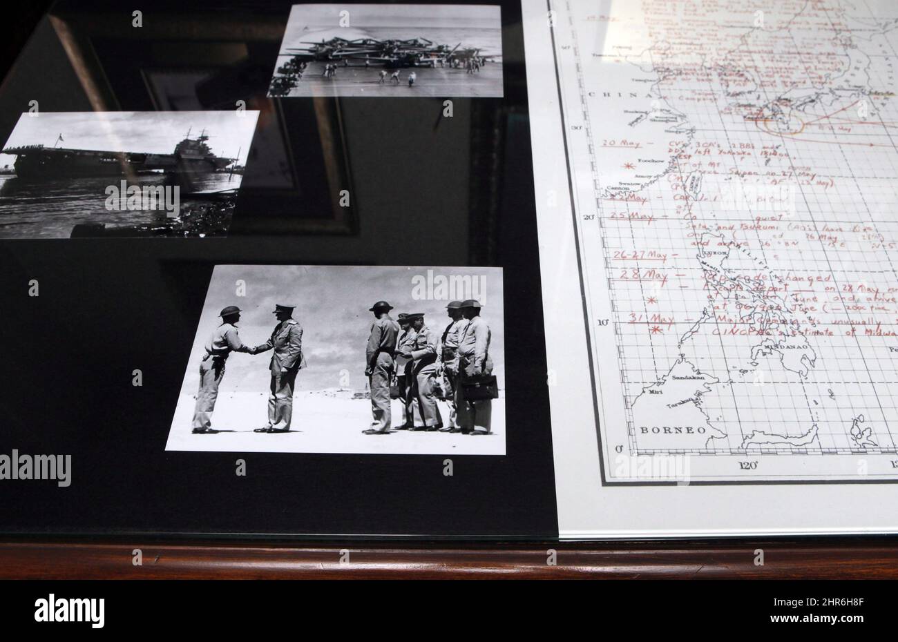 Pictures from historic moments are next to a reproduced map in the ...