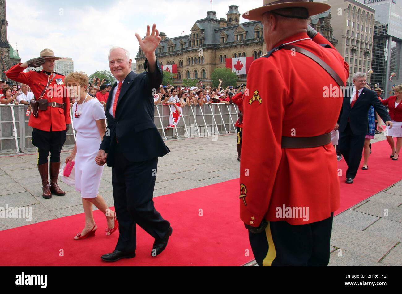 Governor General David Johnston waves as he and his wife Sharon along with Prime Minister ...
