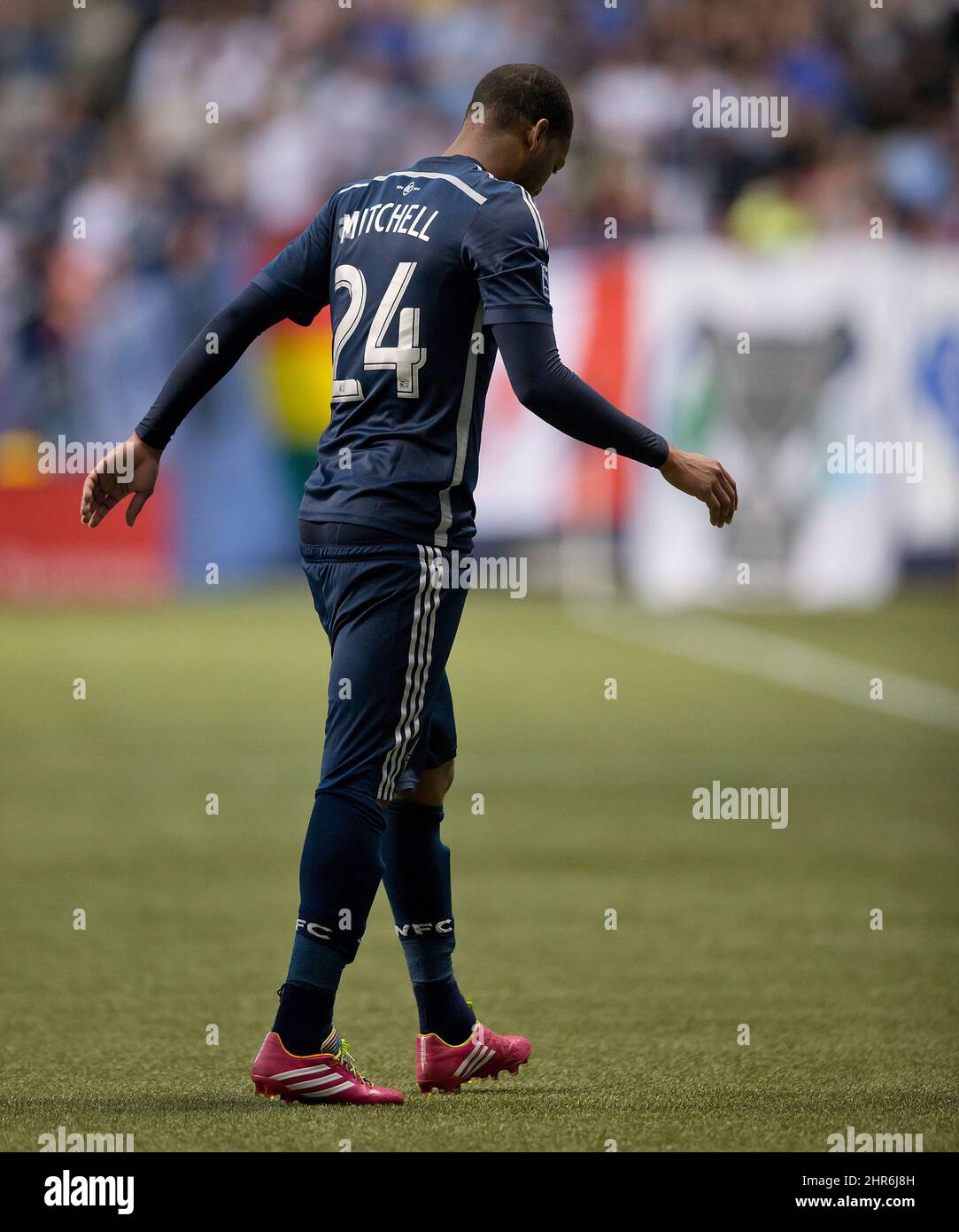 Vancouver Whitecaps' Carlyle Mitchell, of Trinidad and Tobago, limps ...