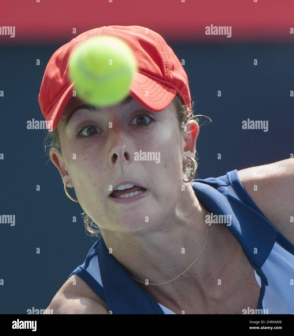 Alize Cornet from France keeps her eyes on the ball during her opening ...
