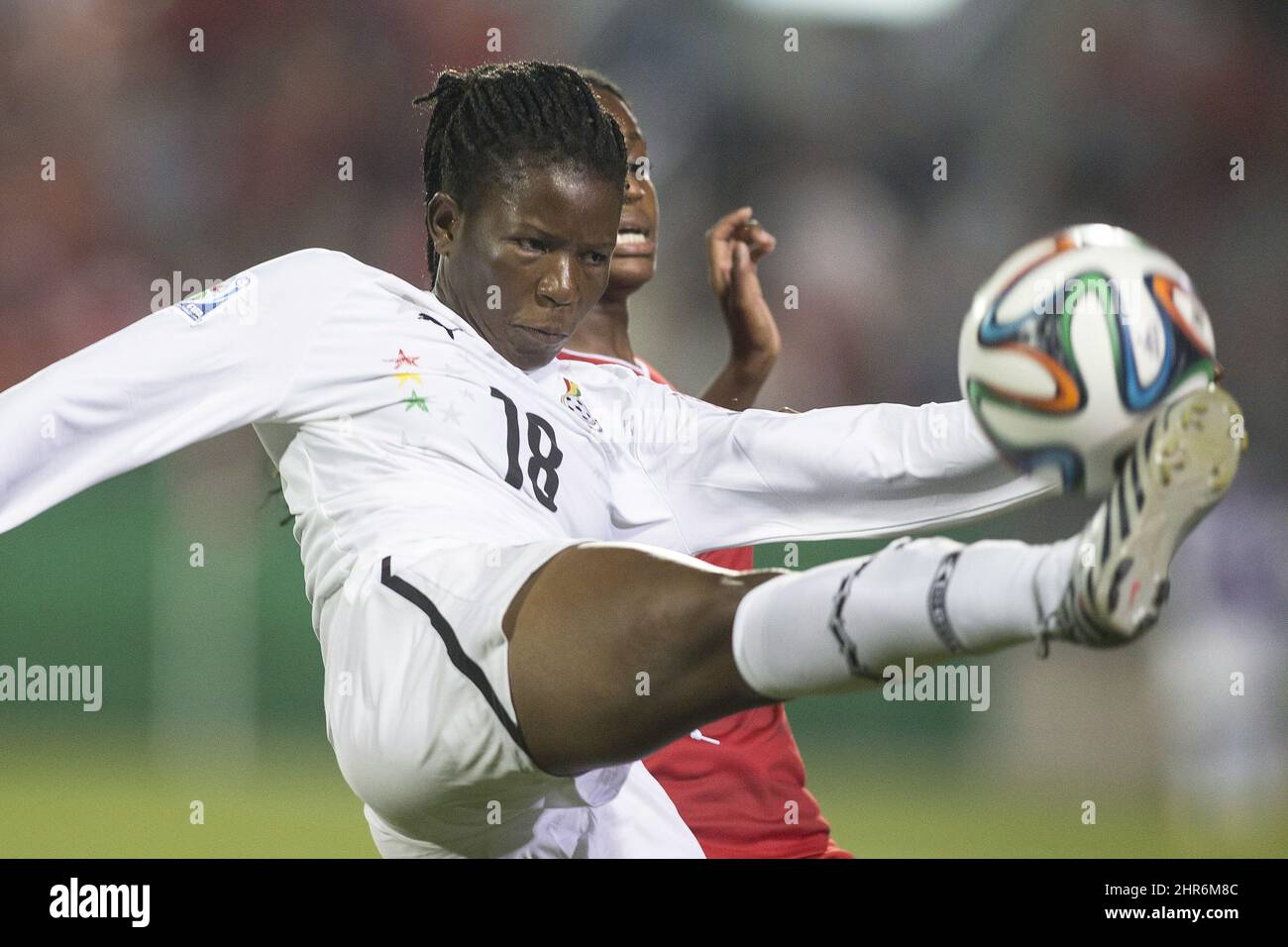 Ghana's Rashieda Abdul Rahman (left) clears from Canada's Nichelle ...