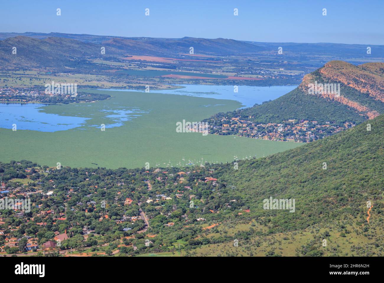 Hartbeespoort Dam surrounded by urban area, Magaliesberg mountain ...