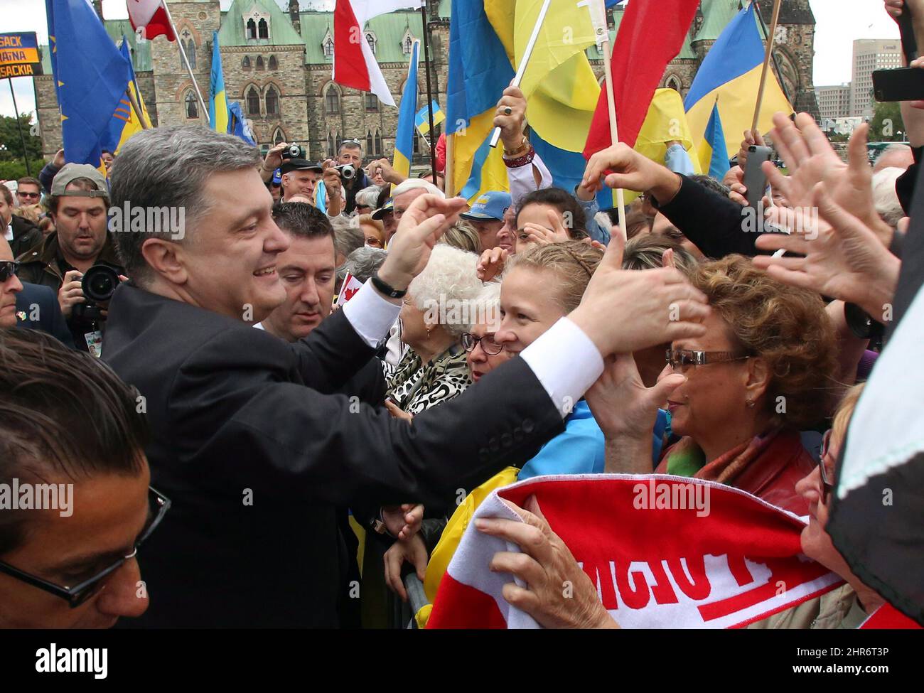 Ukrainian President Petro Poroshenko shakes hands with members of the ...