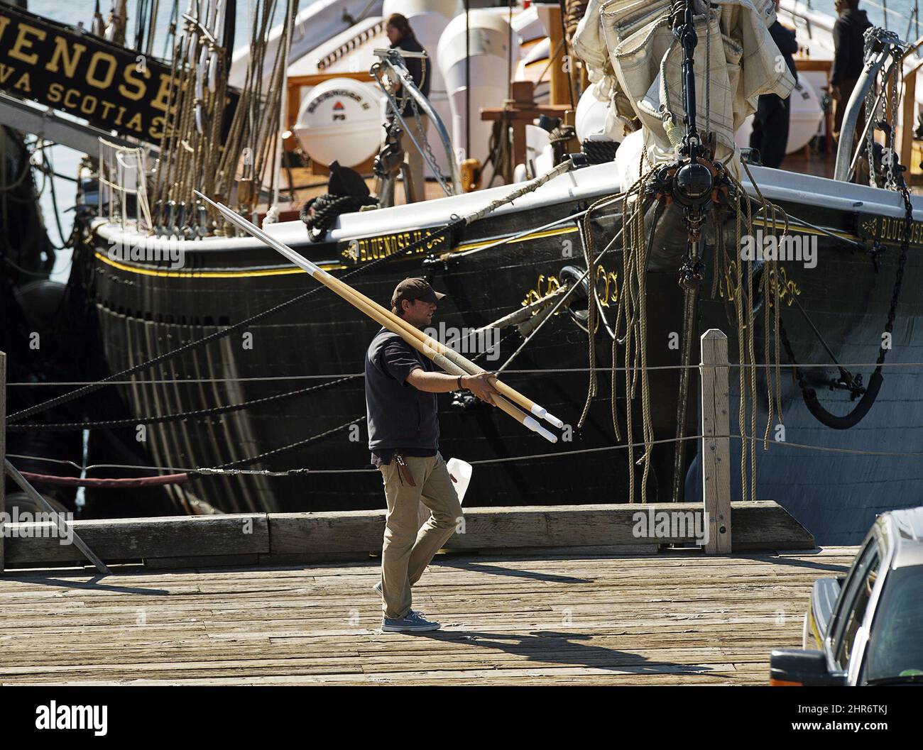A crew member heads past Bluenose II at berth in Lunenburg, N.S. on ...