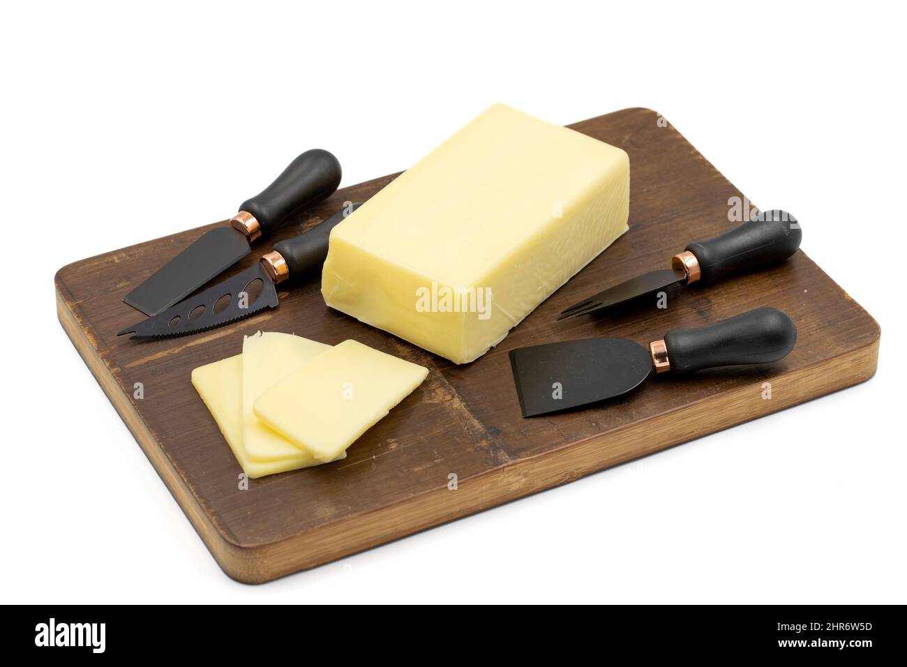 Kashar cheese or kashkaval cheese on white background. Sliced Cheddar ...