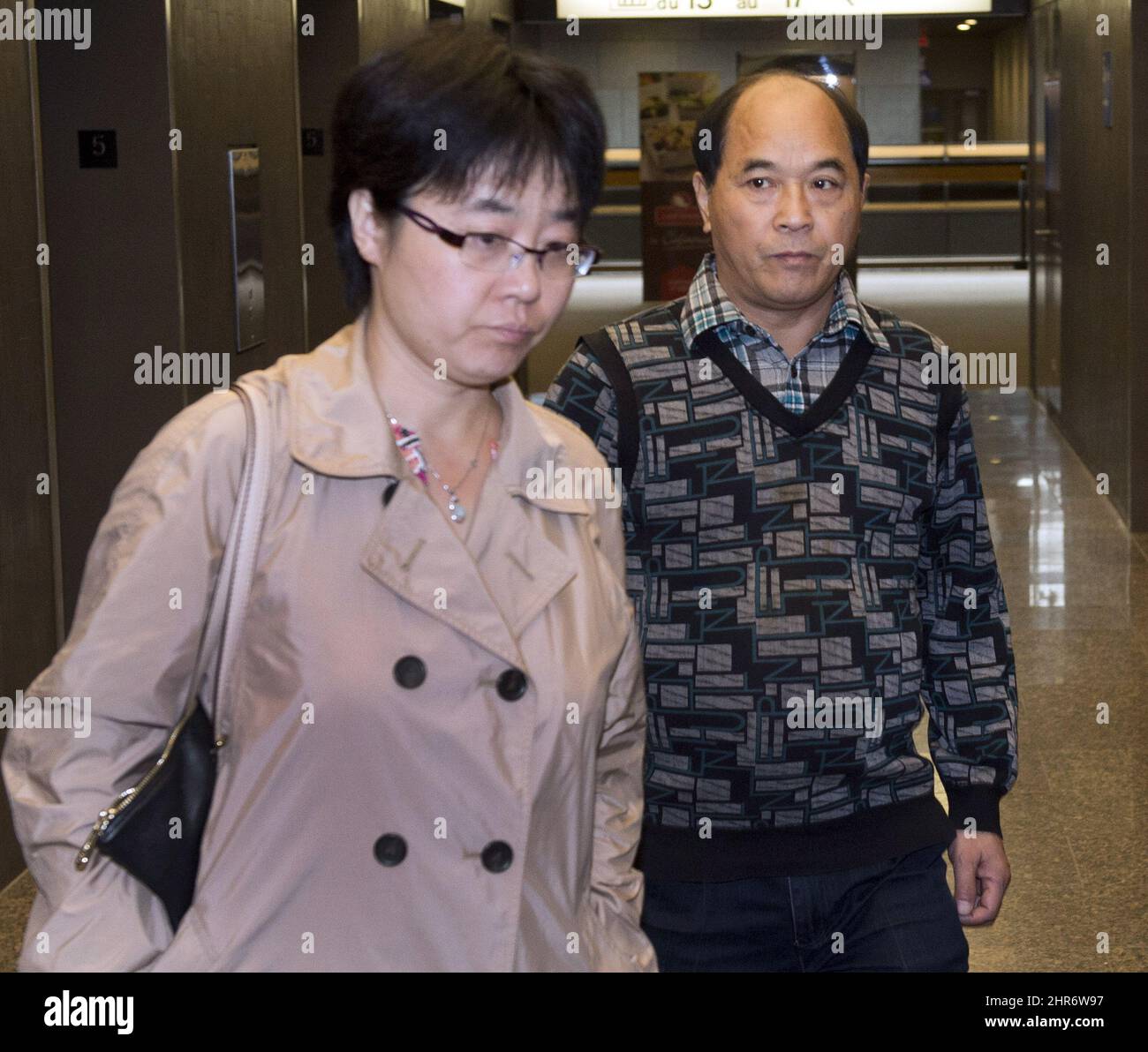 Diran Lin, right, father of Jun Lin, and his translator arrive at the ...