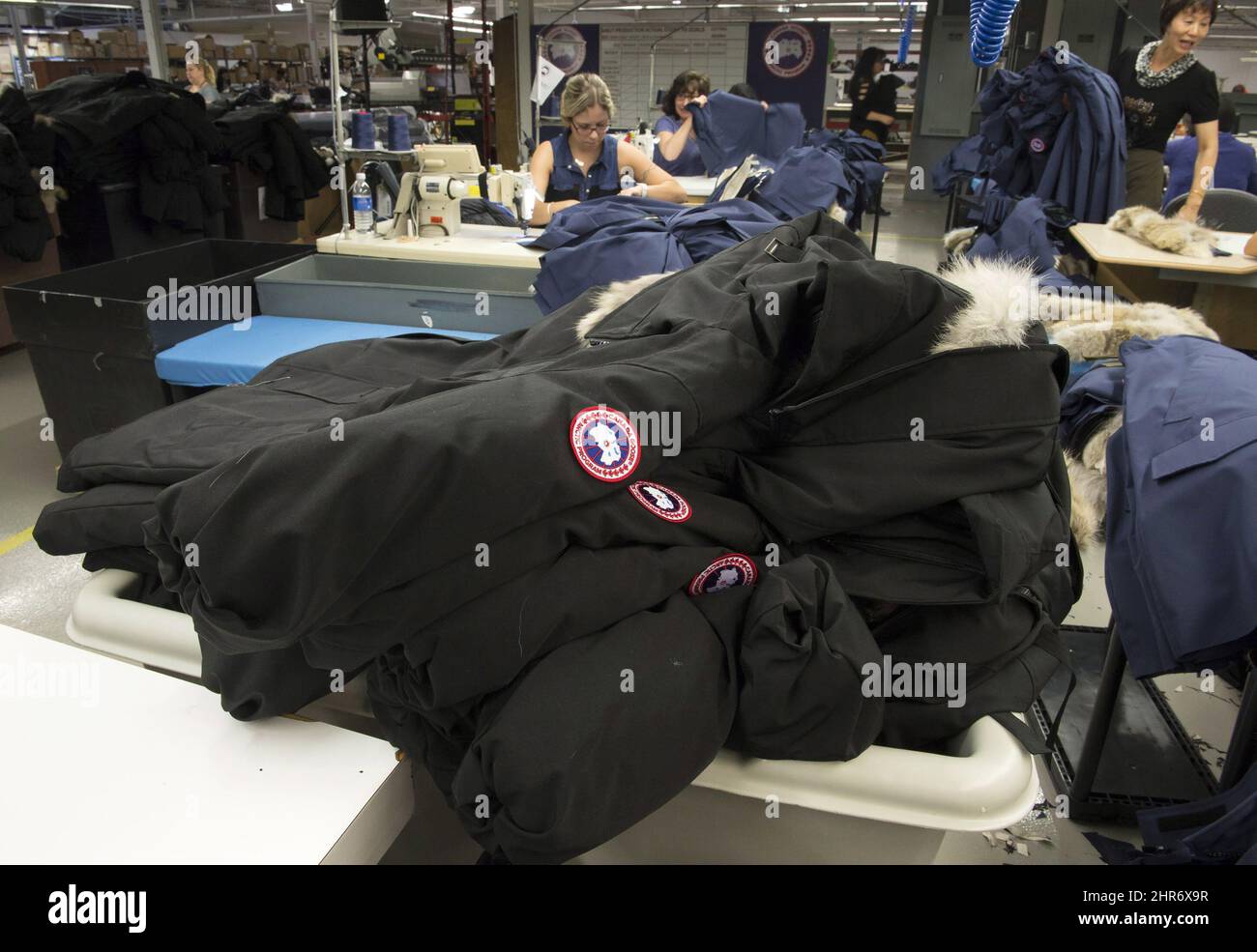 Canada Goose employees work at the clothing company's new factory in ...